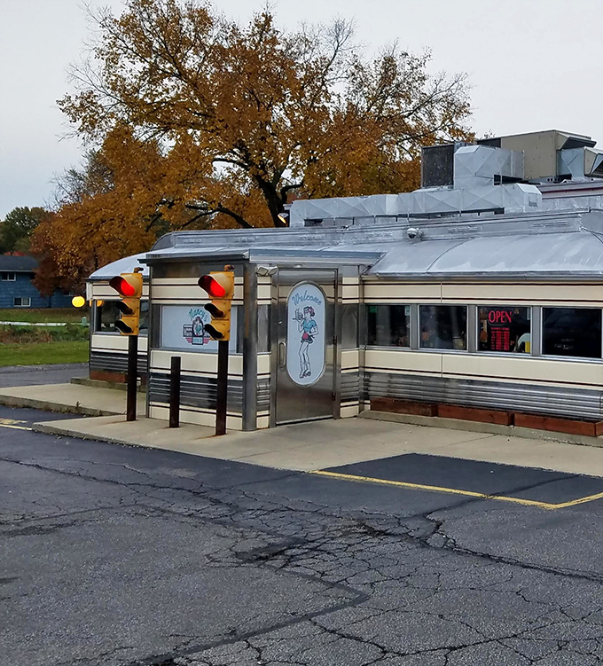 The entrance with its vintage waitress illustration isn't just a door—it's a portal to a simpler time when calories were never counted.