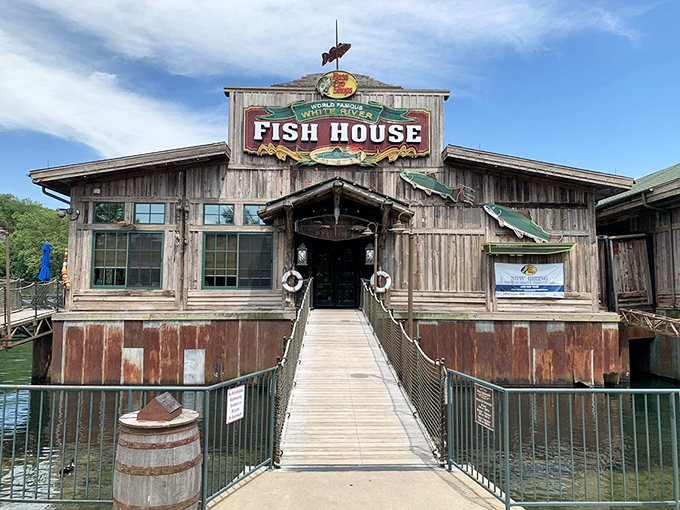 The entrance walkway isn't just a path to dinner&mdash;it's a wooden runway to seafood nirvana. That weathered sign promises delicious adventures ahead.