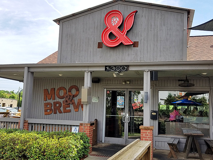 The ampersand shines like a red badge of burger courage, proudly announcing this establishment's dual dedication to patties and pints.