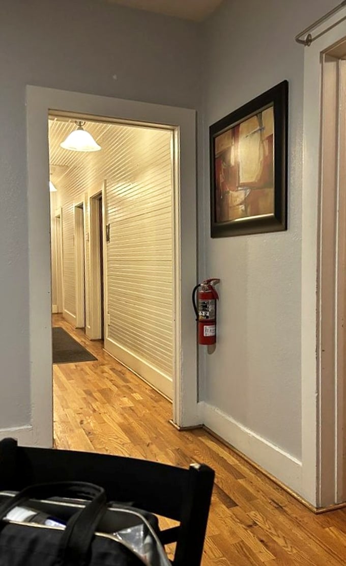 Clean, warm hallways lead to dining spaces where every detail has been considered, right down to the polished wood floors.