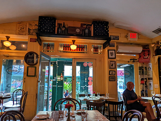 Warm wooden tones and vintage photographs create an atmosphere where time slows down and conversations flow as freely as the wine.