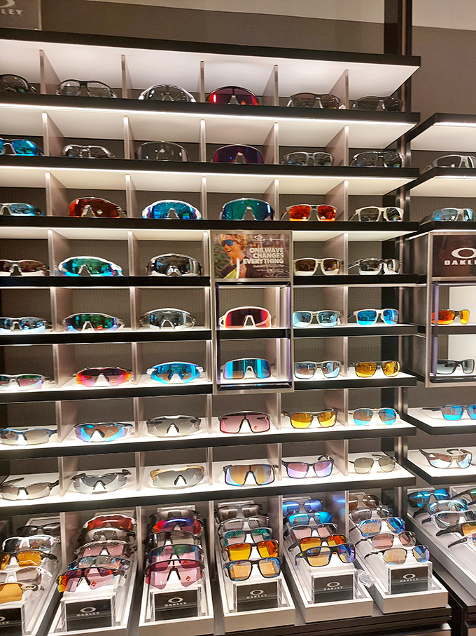 The Oakley store's wall of sunglasses presents a dazzling spectrum of ways to protect your eyes while simultaneously protecting your style credentials.