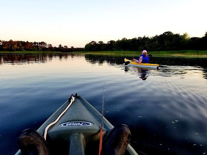 Dawn on the water creates the kind of peace you can't download. Two kayakers discovering that the best social network has always been nature.