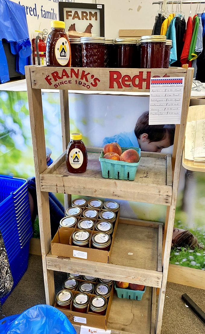 A farmstand display of local honey and preserves. These mason jars contain summer sunshine, ready to brighten winter morning toast.