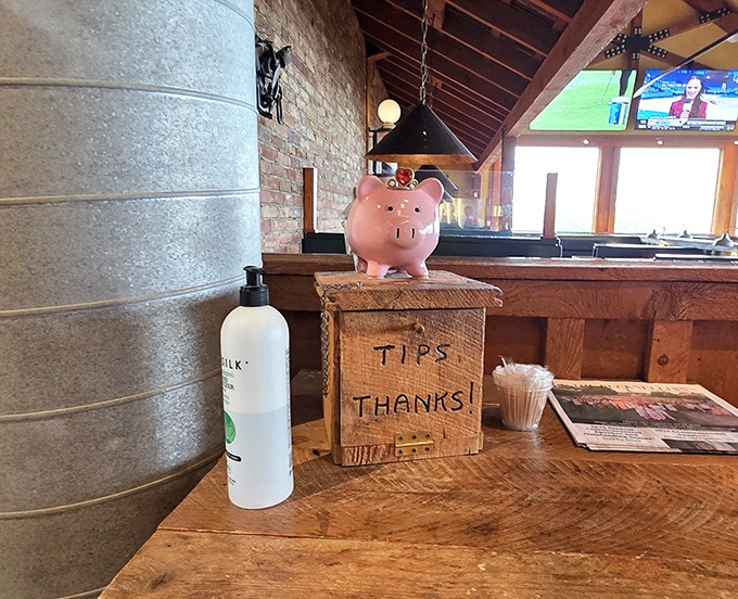 A humble tip jar guarded by a piggy bank&mdash;a wink and nod that your generosity helps keep the smokers smoking and the sauce flowing.