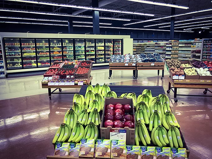 Fresh produce displayed with supermarket precision proves this isn't your average thrift store but a community resource addressing food accessibility.