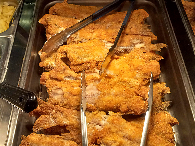 The fried fish lineup—where crispy exteriors guard tender interiors like delicious sentinels of satisfaction. Worth every calorie.