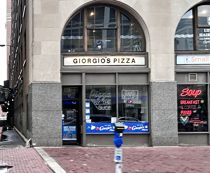 Giorgio's storefront has witnessed decades of downtown evolution, remaining gloriously unchanged in a sea of corporate makeovers.