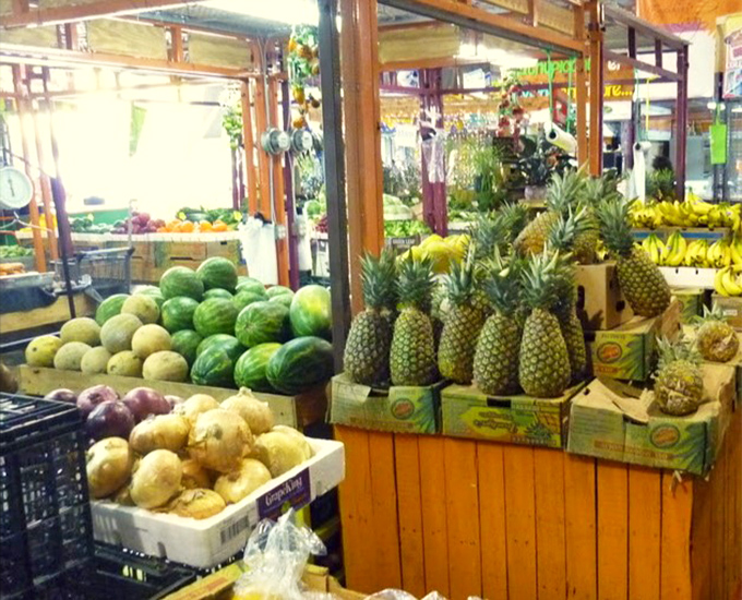 The tropical fruit section&mdash;where pineapples stand at attention and watermelons lounge casually, waiting to become your next poolside companion.