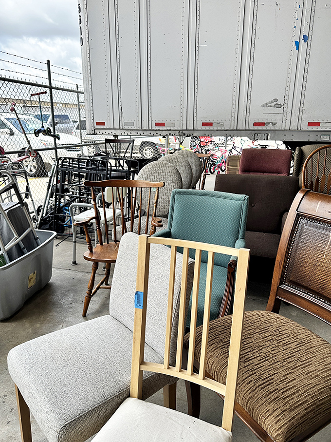 Chair congregation in various states of upholstery. That teal armchair is giving serious "psychiatrist's office from a 90s sitcom" vibes.