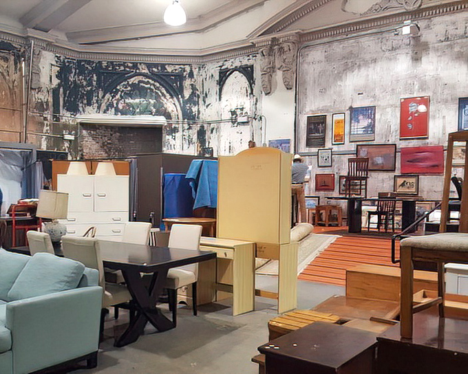 Mid-century meets contemporary in this furniture tableau. That teal armchair is practically begging to become the star of someone's living room.