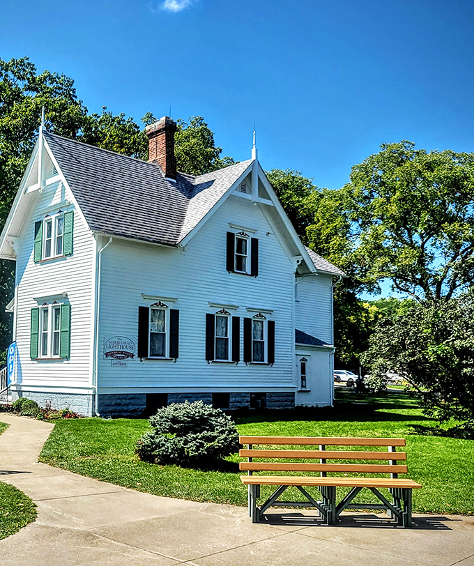 The keeper's house&mdash;where lighthouse history comes alive inside this picture-perfect white cottage with its welcoming green shutters.