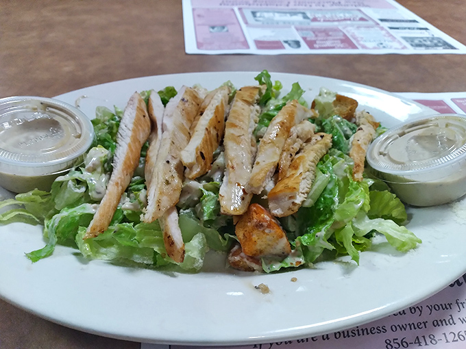A grilled chicken salad for when you want to pretend you're being healthy. The dressing comes on the side &ndash; a nod to restraint.