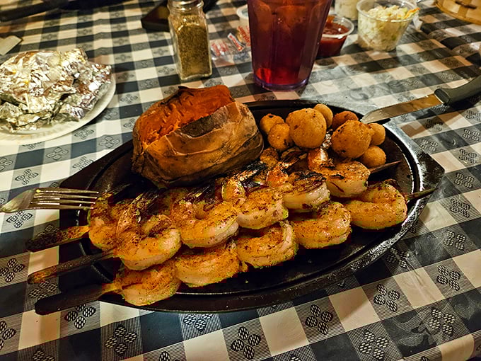 Grilled shrimp that practically dance on the plate, escorting a perfectly baked potato to the ball. Romance on a sizzling platter.