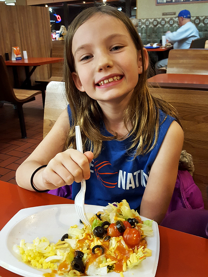 The universal expression of a happy diner&mdash;the next generation of food enthusiasts discovering the joy of a well-executed meal.