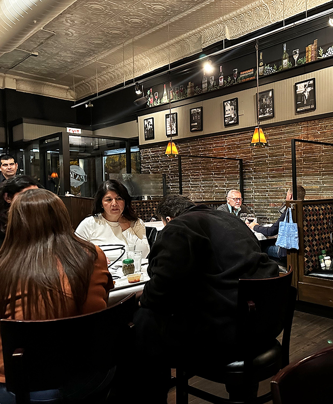The dining room buzzes with the energy of shared meals and conversations—the true soundtrack of any great neighborhood restaurant.