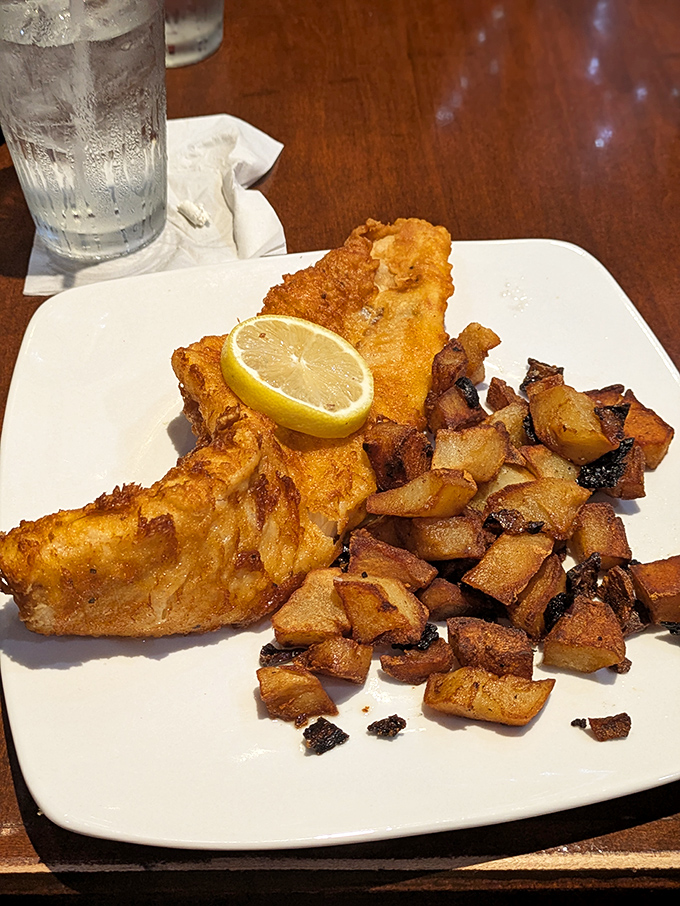 Golden-battered haddock with a bright lemon wedge and home fries cooked to crispy-edged perfection. Fish this fresh makes you forget you're hundreds of miles from any ocean.