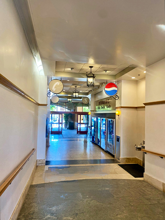 Vending machines and retro signage line the corridor, a welcome respite between shopping conquests.