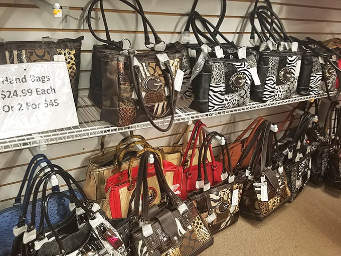 Designer-style handbags at flea market prices make this display more dangerous to wallets than any high-end boutique.