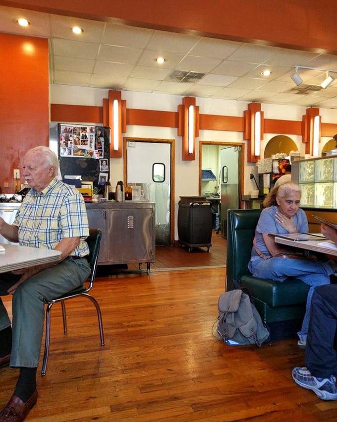 The art deco lighting fixtures cast a warm glow over diners lost in conversation and comfort food&mdash;time slows down here.
