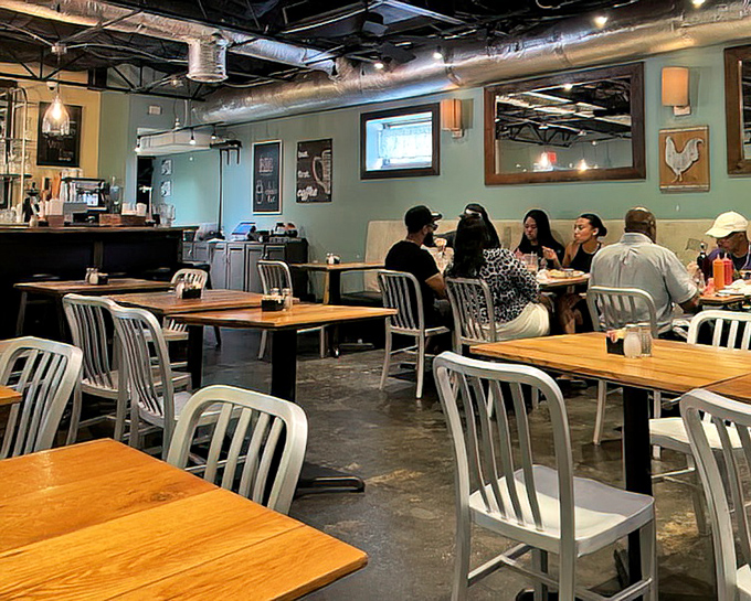 The dining area's exposed ceiling and pendant lights create an atmosphere that says, "Yes, breakfast can be both casual and sophisticated."