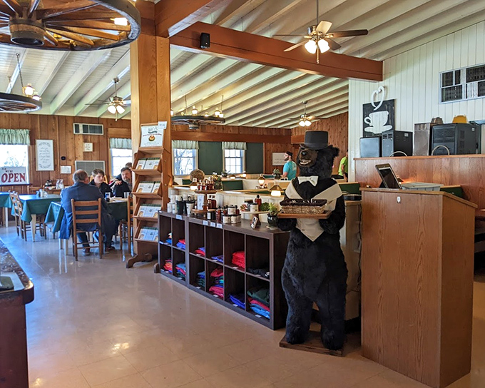 The bear statue stands guard over breakfast treasures. In the pancake wilderness, he's both warning and welcome&mdash;mostly welcome.