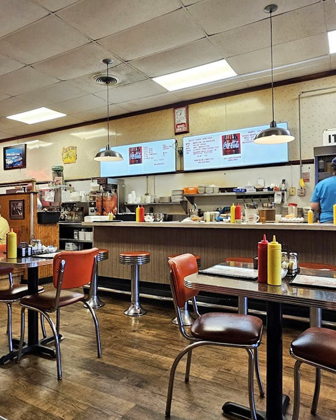 The counter view offers dinner and a show, where short-order cooking becomes performance art worth the price of admission.