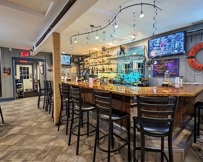 The bar area balances nautical charm with modern comfort, creating a welcoming space where locals and visitors alike swap fishing tales over cold Ohio brews.