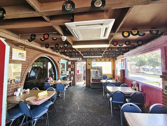 Vinyl records suspended from the ceiling like musical stalactites in this cave of rock 'n' roll memorabilia and comfort food.