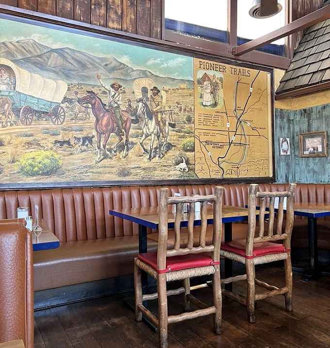 Pioneer spirit lives on these walls—a magnificent mural celebrates the trailblazers who once traversed these same desert lands in search of their dreams.