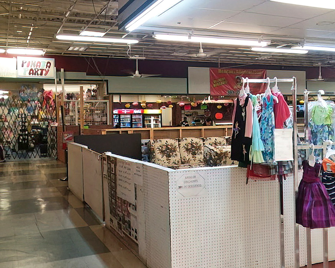 A vendor's carefully arranged wares create retail neighborhoods within the market. Each booth is its own microeconomy of commerce and conversation.