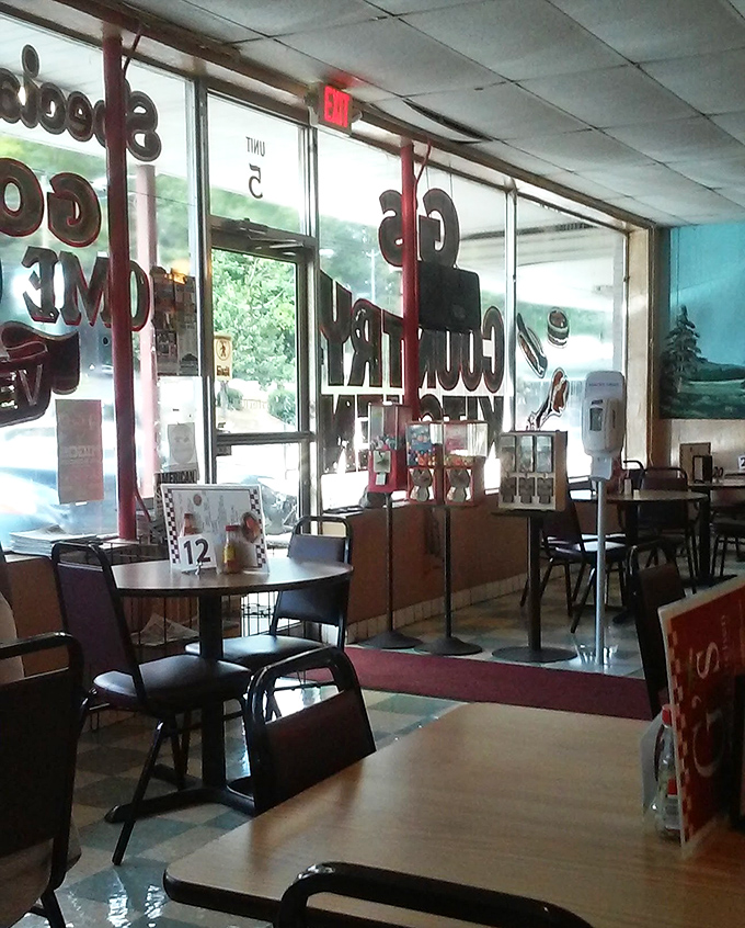 Sunlight streams through windows bearing the restaurant's name &ndash; a beacon for hungry travelers seeking authentic Southern cooking in Huntsville.