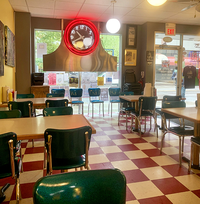 The classic diner atmosphere at The Burger Dive features that iconic checkerboard floor and vintage charm that makes you feel like you've stepped into a time capsule of American comfort.