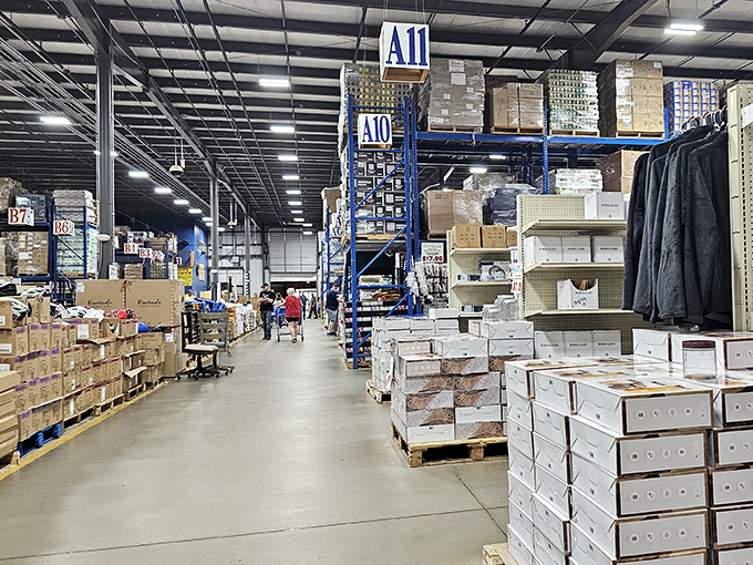 The warehouse perspective that makes shoppers feel like they've entered retail Narnia. Those blue shelving units reach toward heaven, or at least toward more incredible deals.