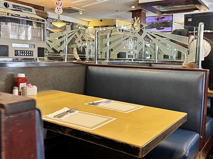 Classic booth dividers with etched glass&mdash;the kind of thoughtful design detail that separates a true diner from mere restaurants. Privacy with a side of pancakes.