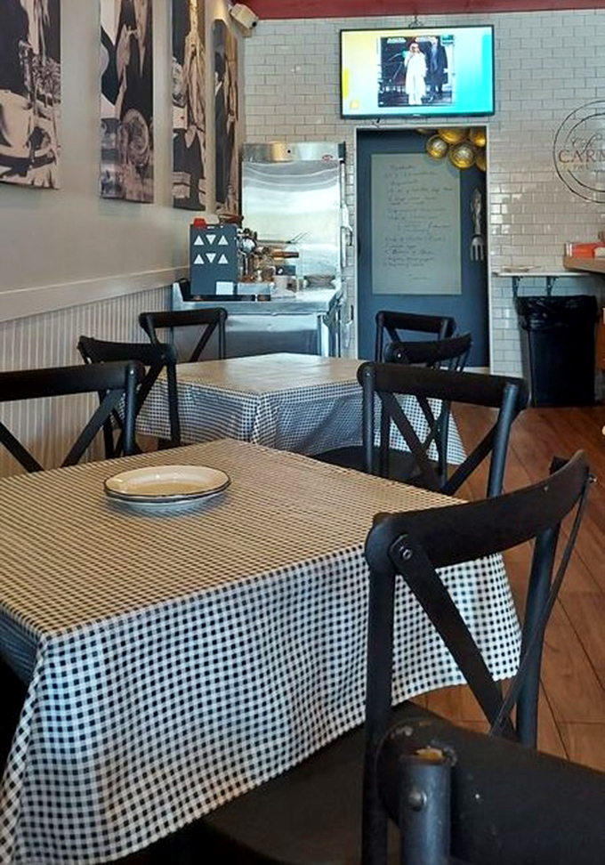 Classic black chairs against crisp white tablecloths create the perfect stage for culinary drama to unfold. Simplicity at its finest.