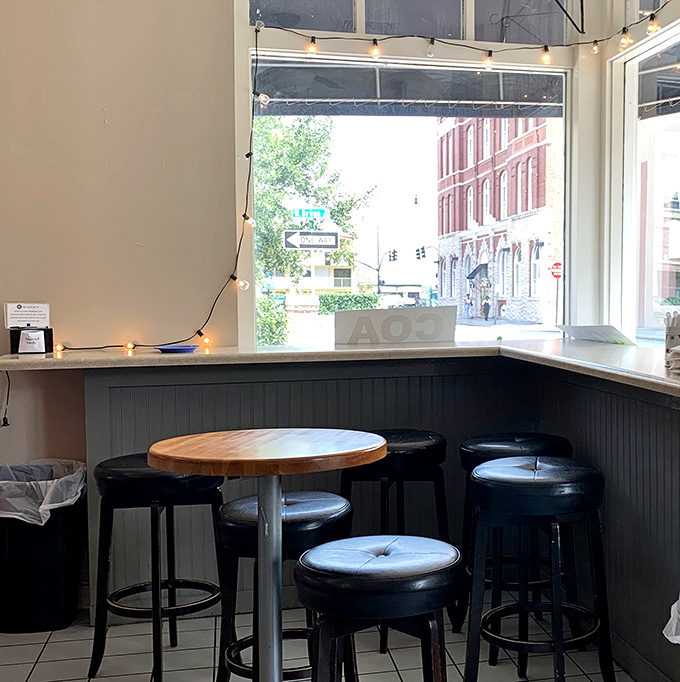 String lights and bar seating by the window&mdash;the perfect spot to contemplate life's big questions over something wrapped in pastry.