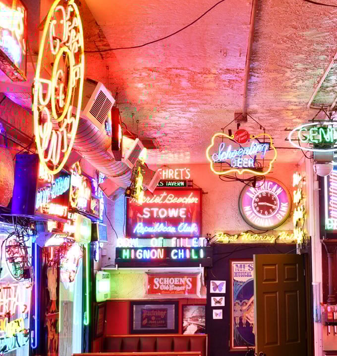 Neon heaven! The ceiling at The Turf Club is where vintage signs go when they've lived a good life, creating a kaleidoscope of nostalgic light.