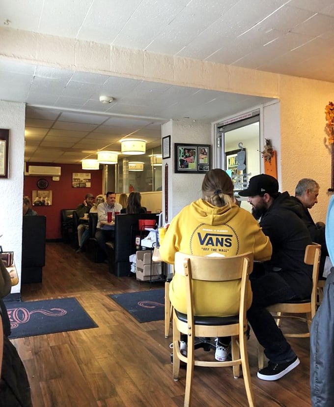The cozy interior invites lingering conversations and second cups of coffee. Wood floors and simple lighting create the backdrop for breakfast memories.