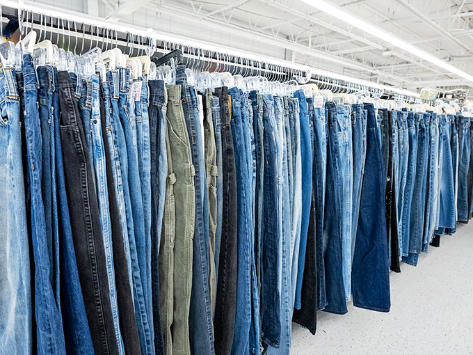 The denim wall &ndash; a blue jean rainbow where someone else's "these don't fit anymore" becomes your perfect pair.