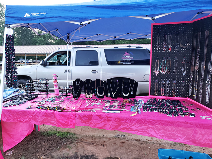 Jewelry display that proves more is more. This pink-tableclothed booth transforms the humble parking lot into an open-air accessory emporium.
