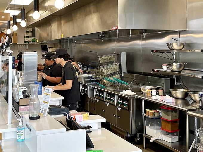 The kitchen at Super Chix operates with the precision of a Swiss watch, if Swiss watches were designed to produce perfect fried chicken.