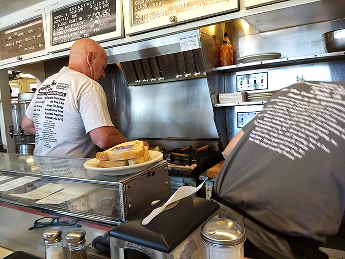 The open kitchen at Kuppy's offers dinner and a show&mdash;skilled short-order cooks performing their morning ballet of flipping, grilling, and plating with practiced precision.