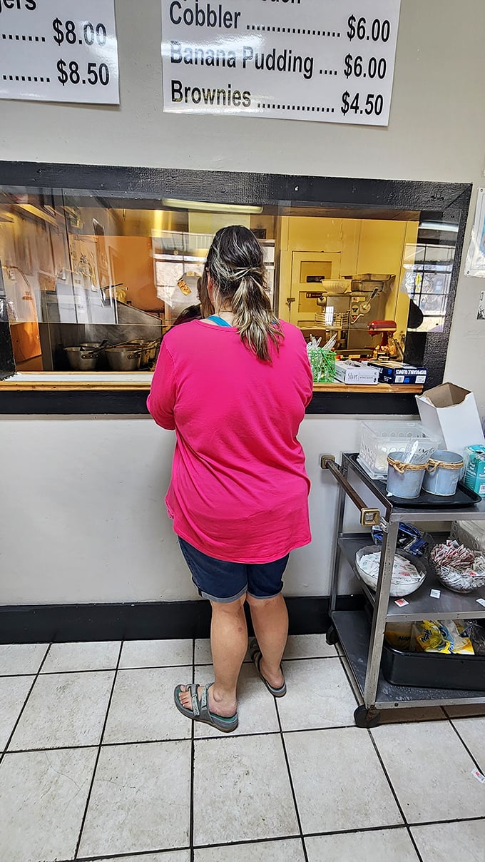 A glimpse into the kitchen where Southern cooking traditions are preserved one batch at a time. Some windows reveal more than views.