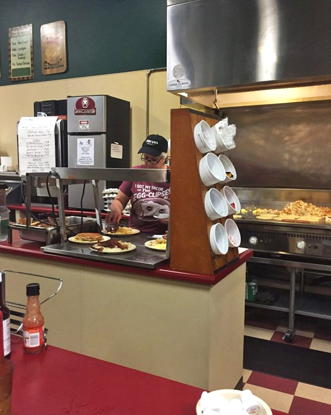 Where the magic happens! The open kitchen design lets you witness breakfast artistry in action. Those cooks move with the confidence of breakfast veterans.