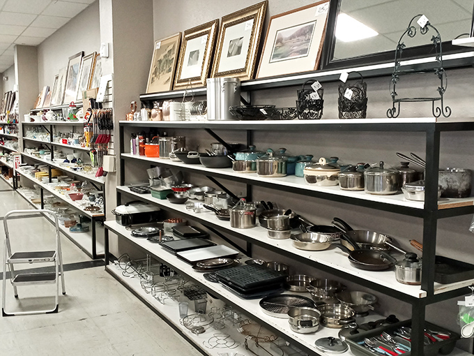 The kitchenware section: where seasoned cast iron pans with stories to tell wait for their next culinary adventure.