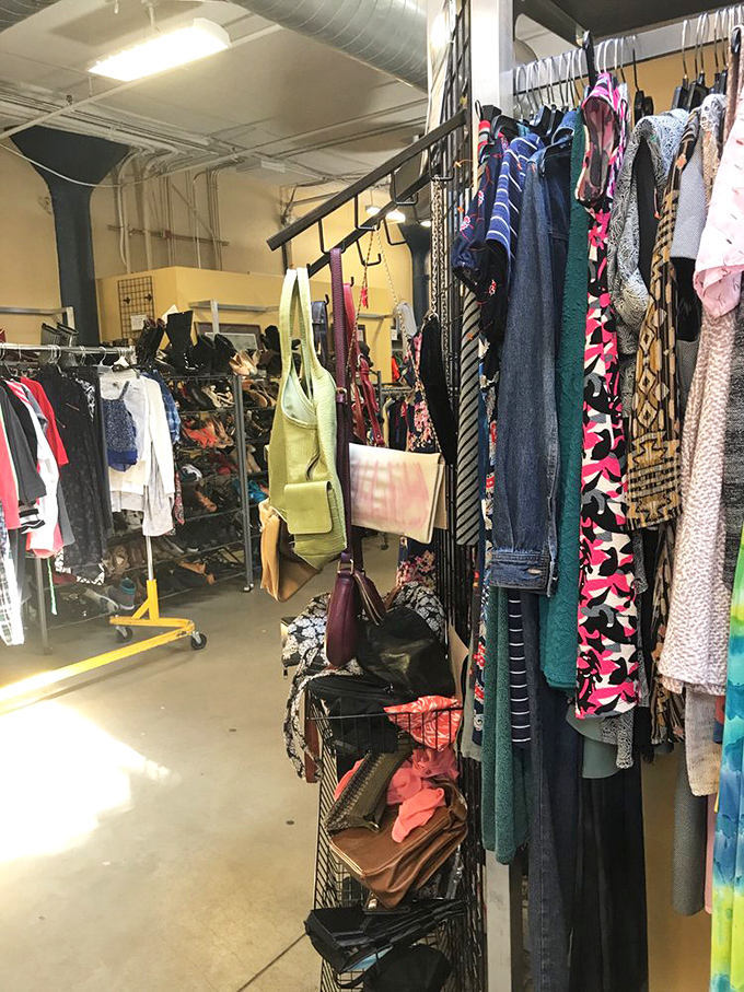 Scarves and accessories cascade down metal grids like a bohemian waterfall of fashion possibilities waiting to be discovered.