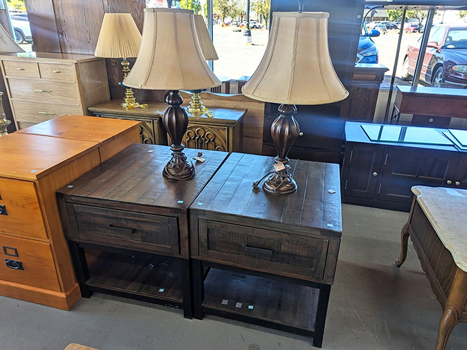 Matching lamps that somehow escaped the 1980s intact sit atop rustic end tables, ready to illuminate your reading nook with warm, nostalgic light.