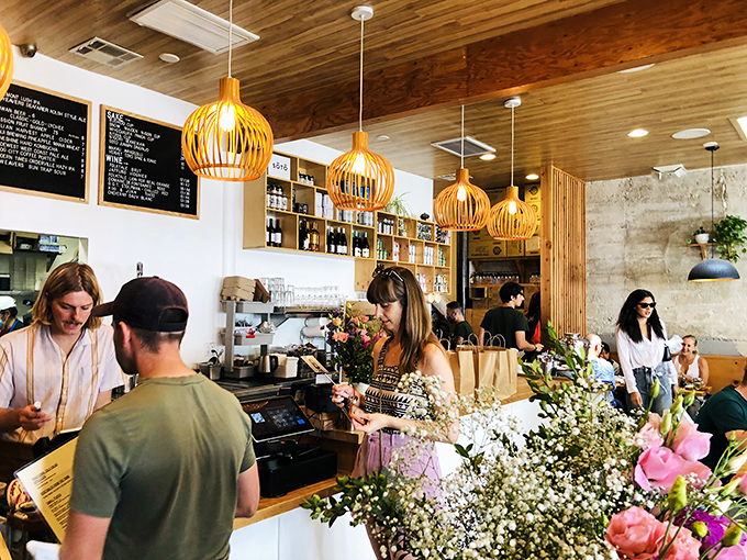Ordering at Pine & Crane feels like joining a delicious club. Fresh flowers brighten the counter where life-changing food decisions are made daily.