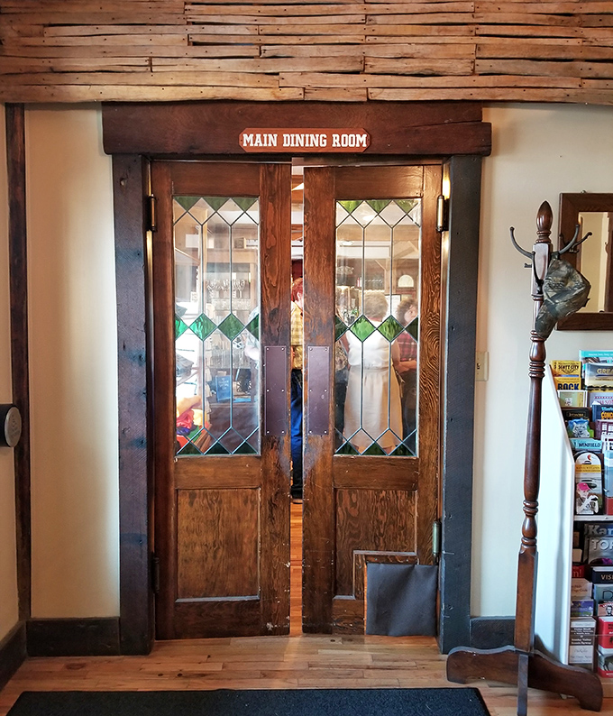 The stained glass doors to the main dining room aren't just an entrance&mdash;they're a portal to a time when dinner was an event, not just a meal.